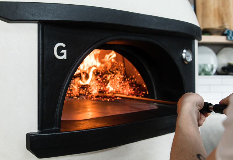 Gozney grabs a quick slice of pizza oven action